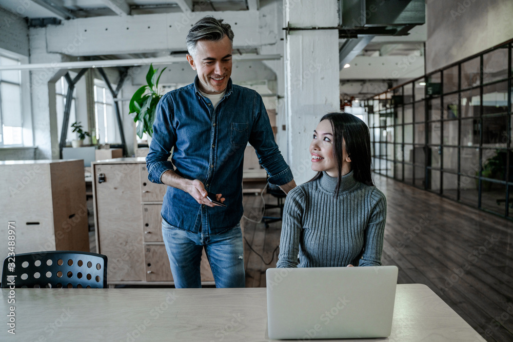 Supervisor and subordinate relationships in office. Adult man and woman ...