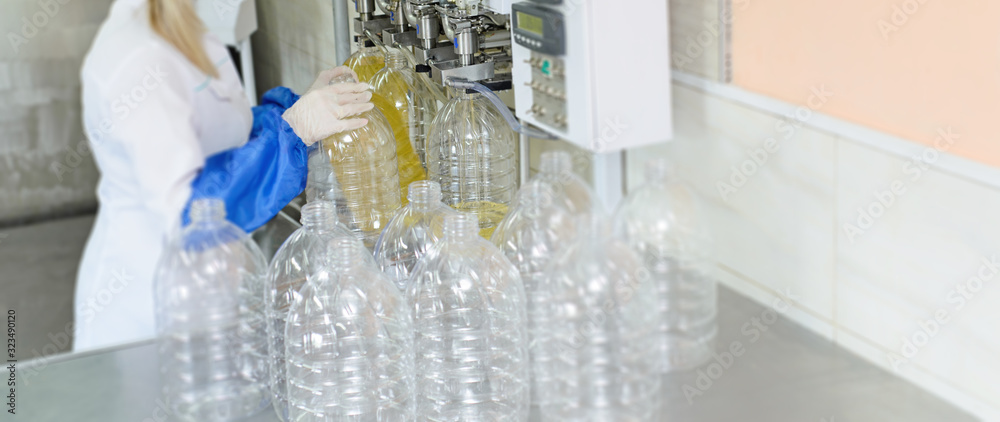 Sunflower oil factory. Factory line of production and filling of ...