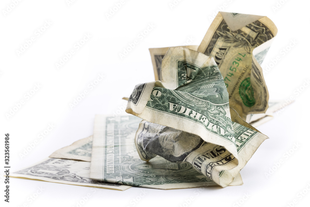 illustrating wasted savings opportunity, a crumpled US dollar bill on a ...