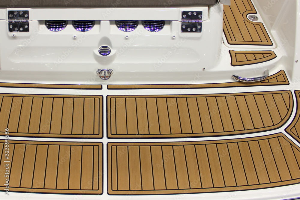 Brown marine teak motor yacht deck, big swimming platform on stern ...