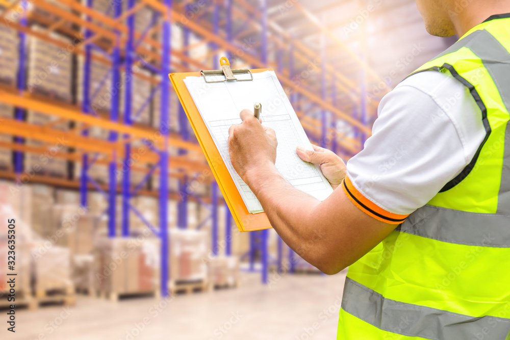 Warehouse worker hand holding clipboard inspecting details checklist ...