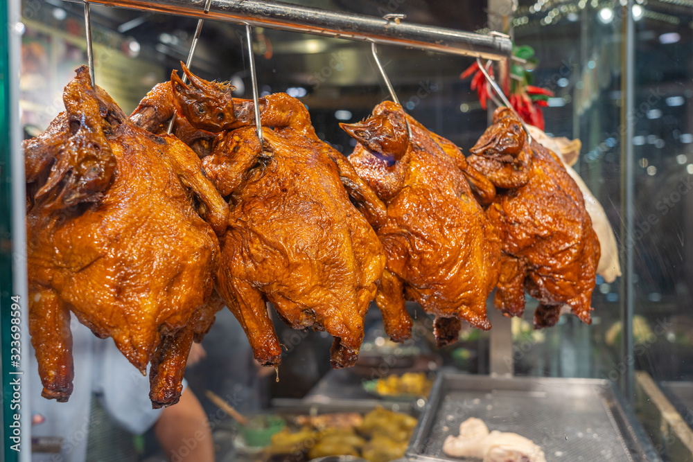 Delicious roasted whole chickens displayed in Singapore food restaurant ...