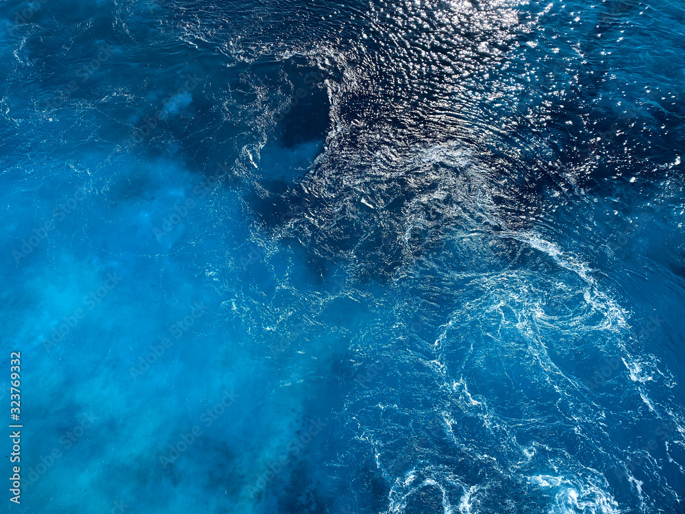 Natural blue background. Blue surface of sea water with wave and foam ...