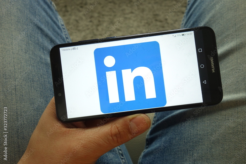 KONSKIE, POLAND - May 04, 2019: Man holding smartphone with LinkedIn ...