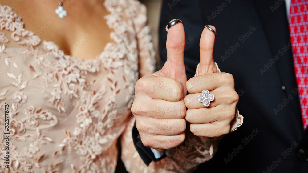 wedding rings on fingers painted with the bride and groom Stock Photo ...