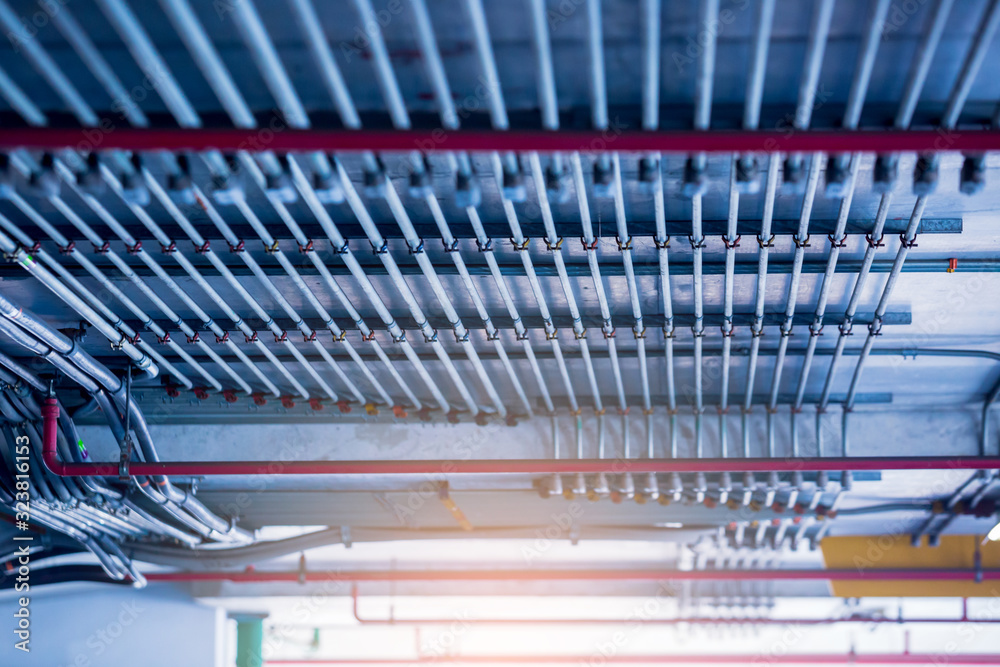 Blurry picture of electrical conduit and cabling. Blurry image for ...