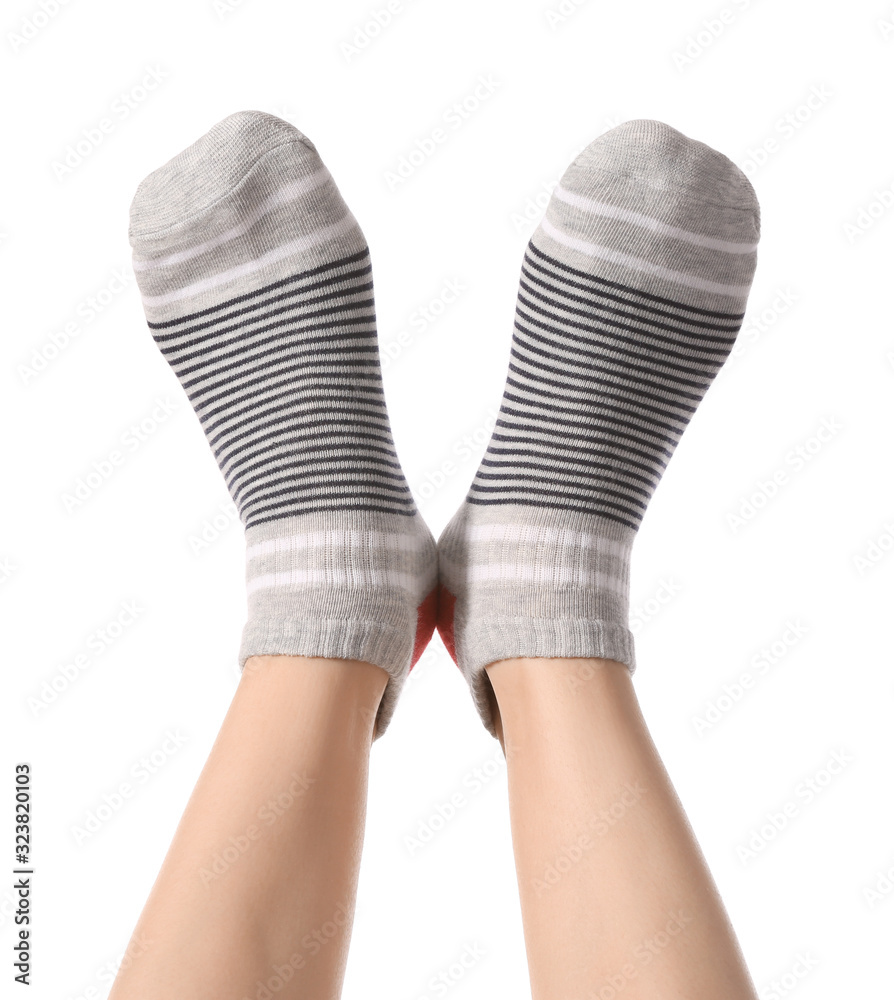 Legs of young woman in socks on white background Stock Photo | Adobe Stock