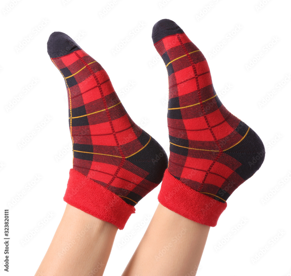 Legs of young woman in socks on white background Stock Photo | Adobe Stock