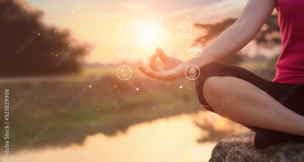 Hand of woman on nature with icons energy sources for renewable ...