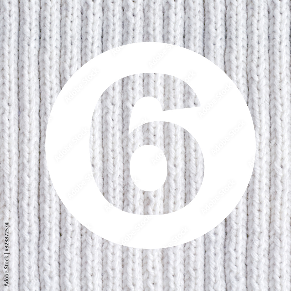 Number " 6 " is a knitted number isolated on a white background ...