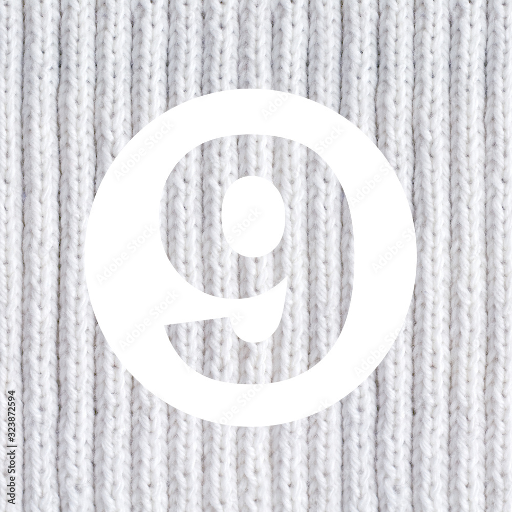 Number " 9 " is a knitted number isolated on a white background ...