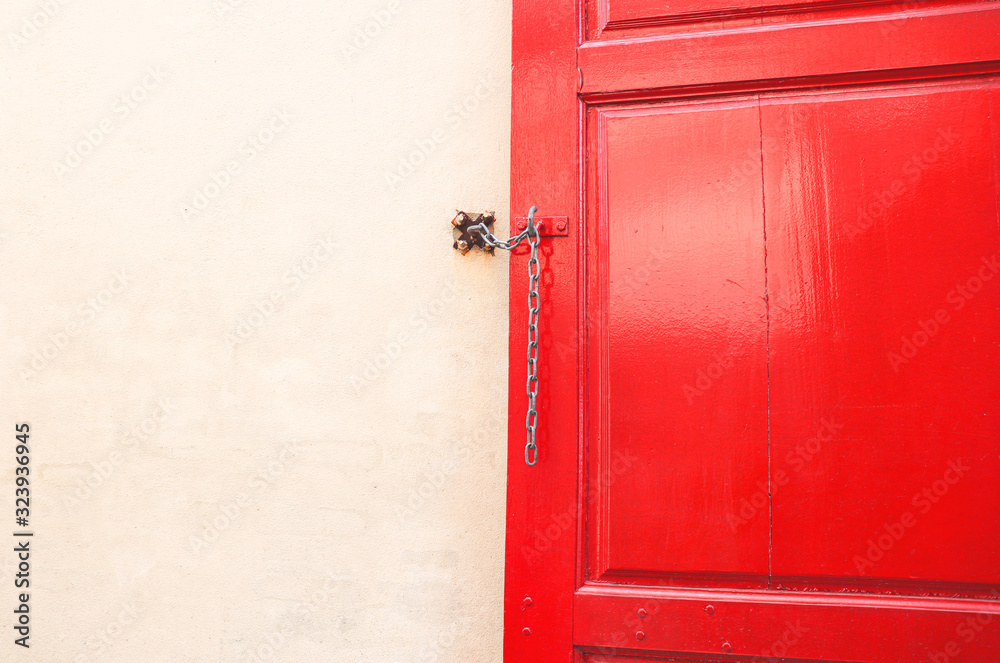 Large solid RED wood door was tied by the Chains to the old white ...
