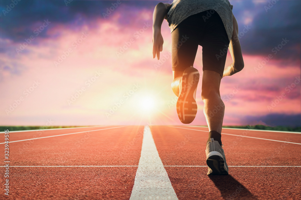 Sports background. Sprinter leaving starting blocks on the running ...