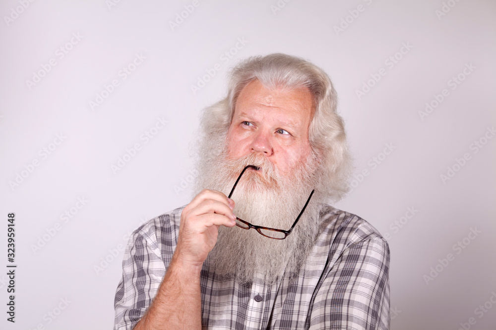 Senior thickset Caucasian happy man with splendid grey hair and beard ...