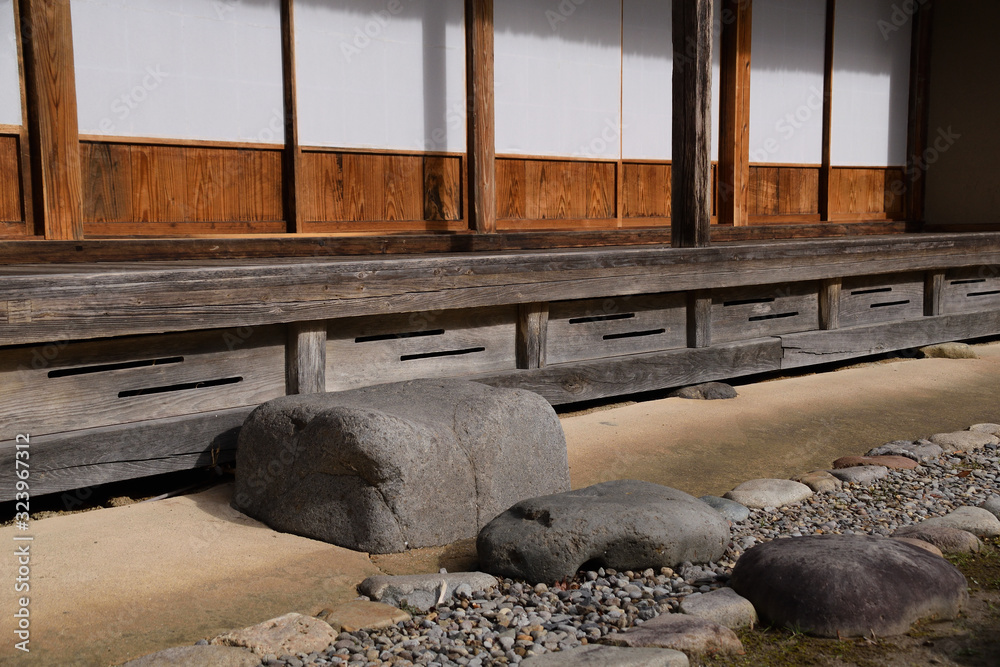 Stepping stone of a traditional Japanese house. It is called “Fumiisi ...