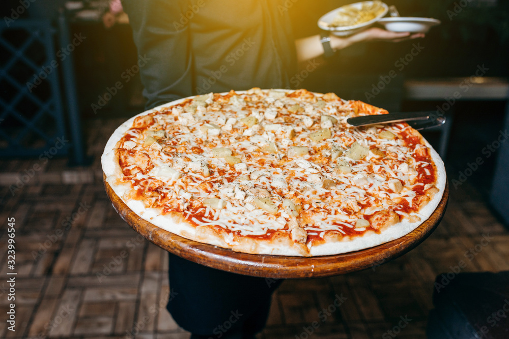Very big Pizza with waiter in restoraunt. Italian food Stock Photo ...