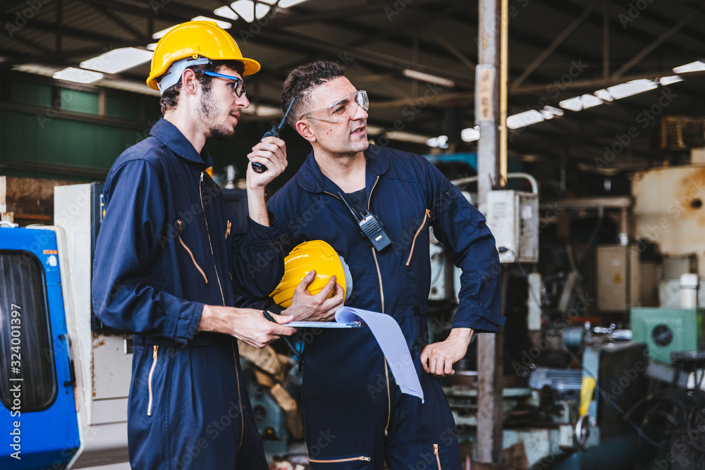 Foto de Group of industrial factory maintenance engineers inspect relay ...