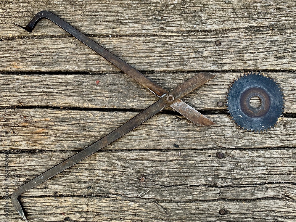 Workbench with tools from an old workshop. Metal scissors and circular ...
