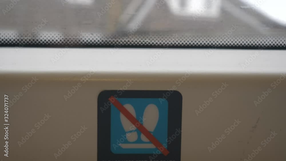 A sign saying no putting feet on train seats and tables. Stock Video ...
