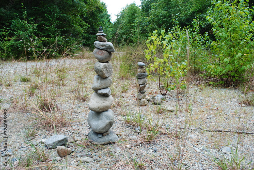 Cairns (rock sculptures) in the forest- built and left behind in the ...