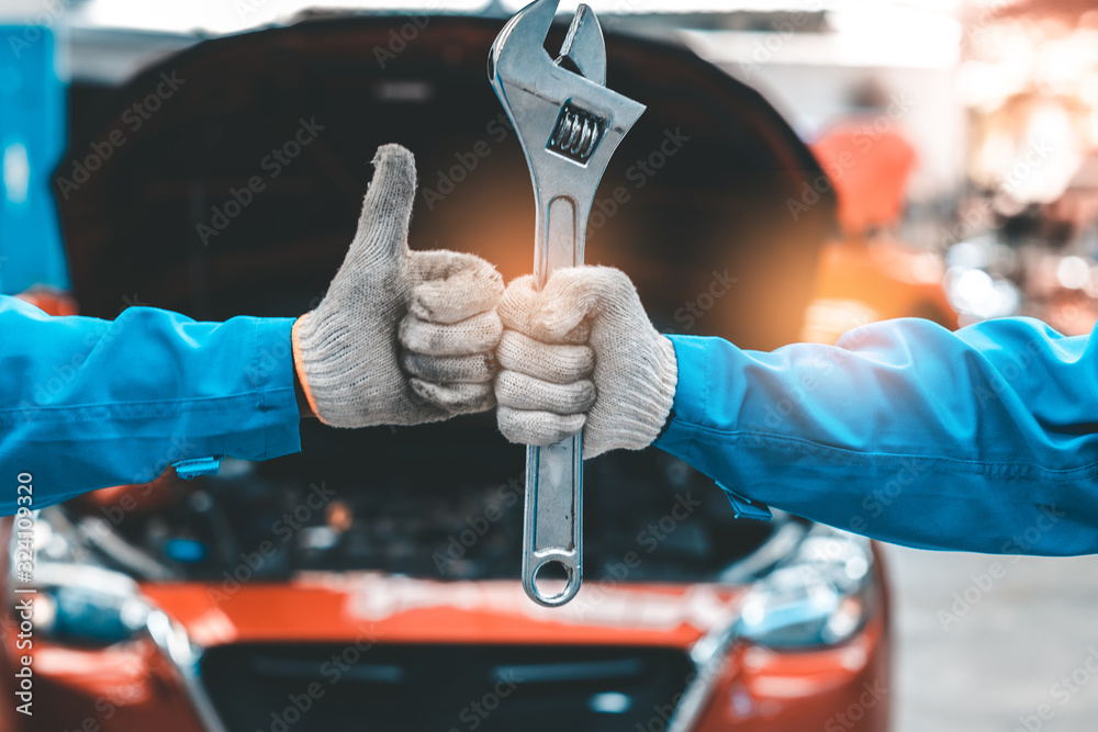Car Mechanic Ready For Work. Auto Mechanic with Large Wrench in Hands ...