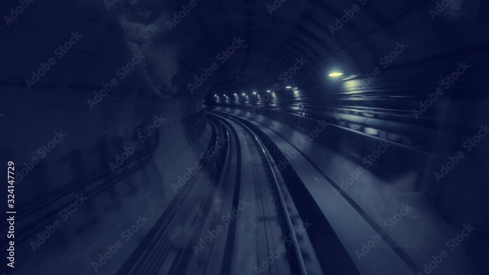 Train moves inside the underground tunnel, POV of the subway system and ...
