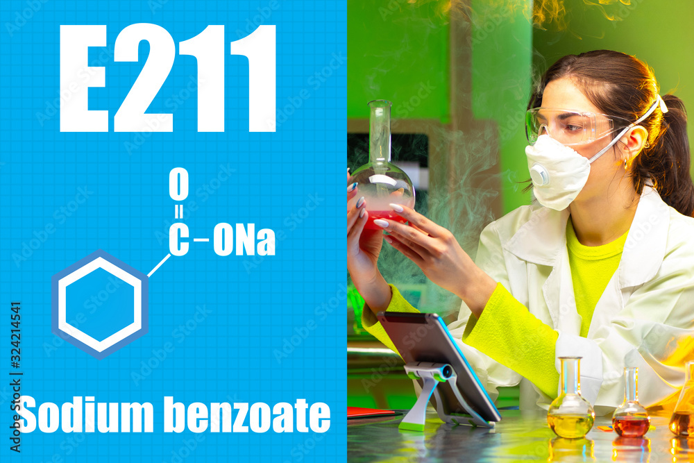 Sodium benzoate. E211. Formula of sodium benzoate on a blue background ...
