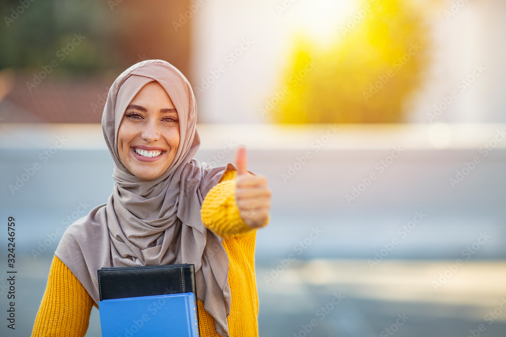 Muslim woman with hijab with hand sign ok. Happy Muslim student posing ...