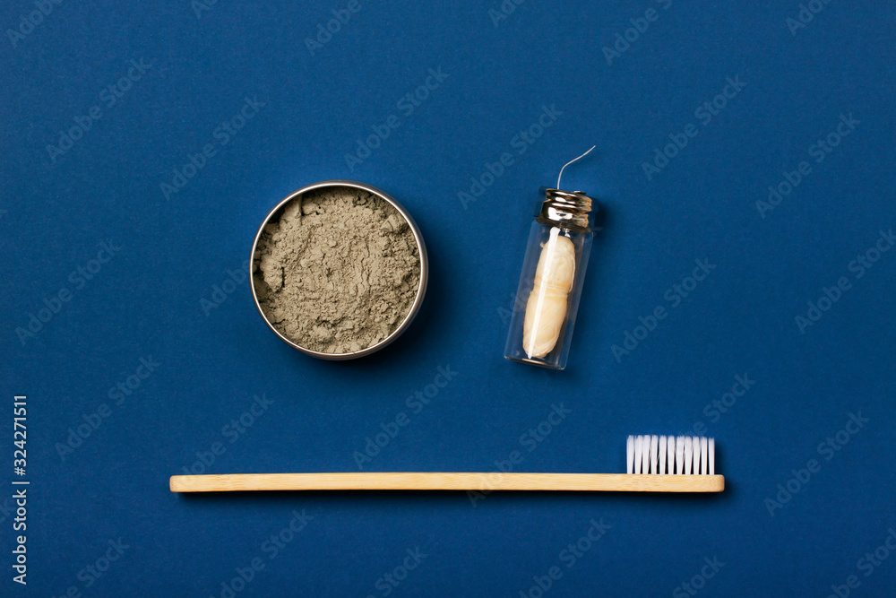 Set of eco-friendly tooth care items on the blue background. Bamboo ...