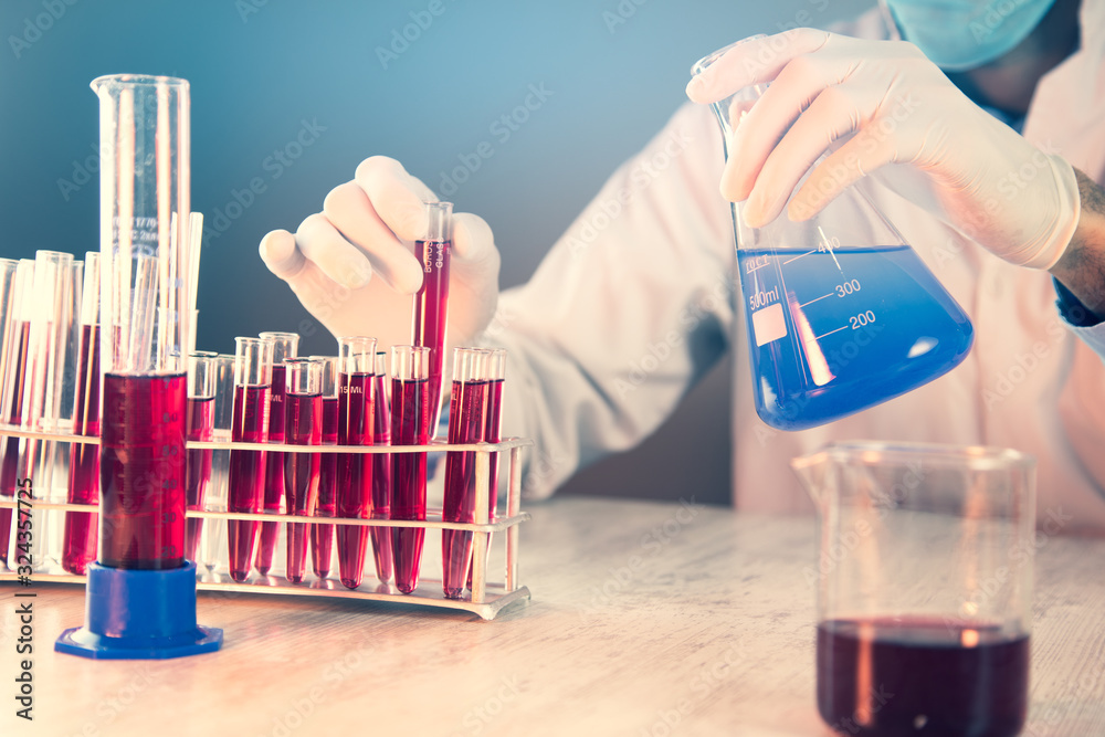 Biochemistry laboratory research,Chemist is analyzing sample Stock ...