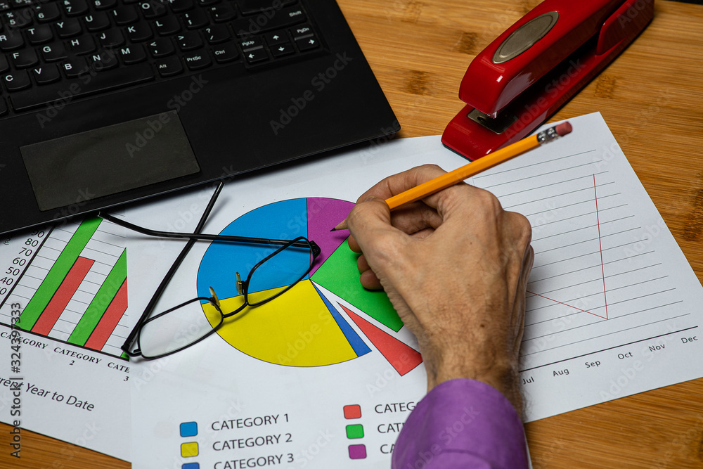 Desktop Business workspace with a laptop, a #2 pencil and Stapler and ...