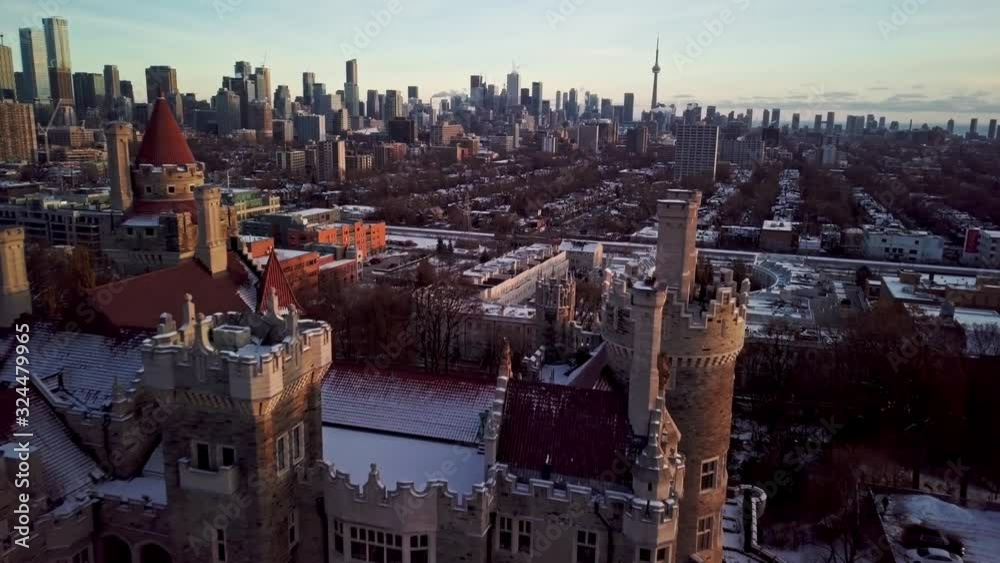 Exciting Aerial Reveal of Old Castle above Downtown Toronto at Sunset ...