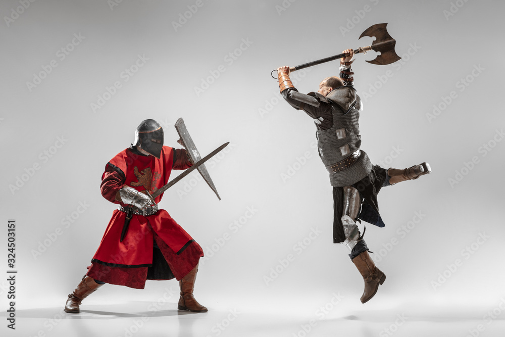 Brave armored knights with professional weapon fighting isolated on ...