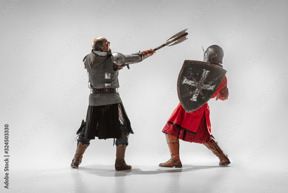 Brave armored knights with professional weapon fighting isolated on ...