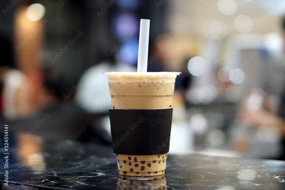Bubble Milk Tea - A plastic glass of milk tea with black sugar syrup ...
