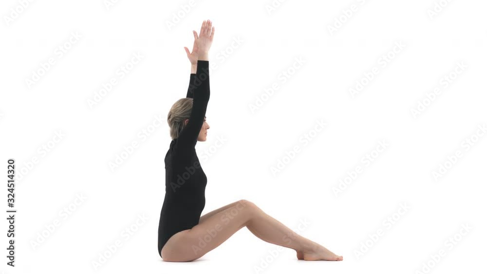 Yoga mat woman stretching hip, hamstring muscles and groin area. Fit ...