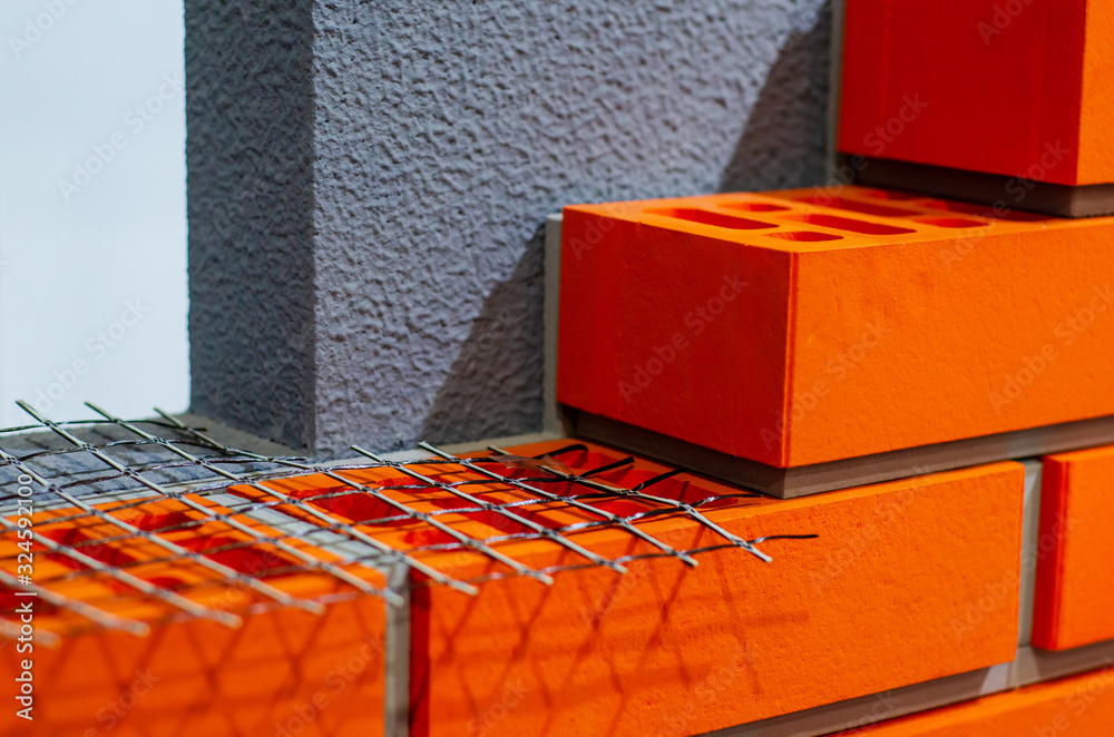 Modern layout of the construction of walls with brick masonry. External ...