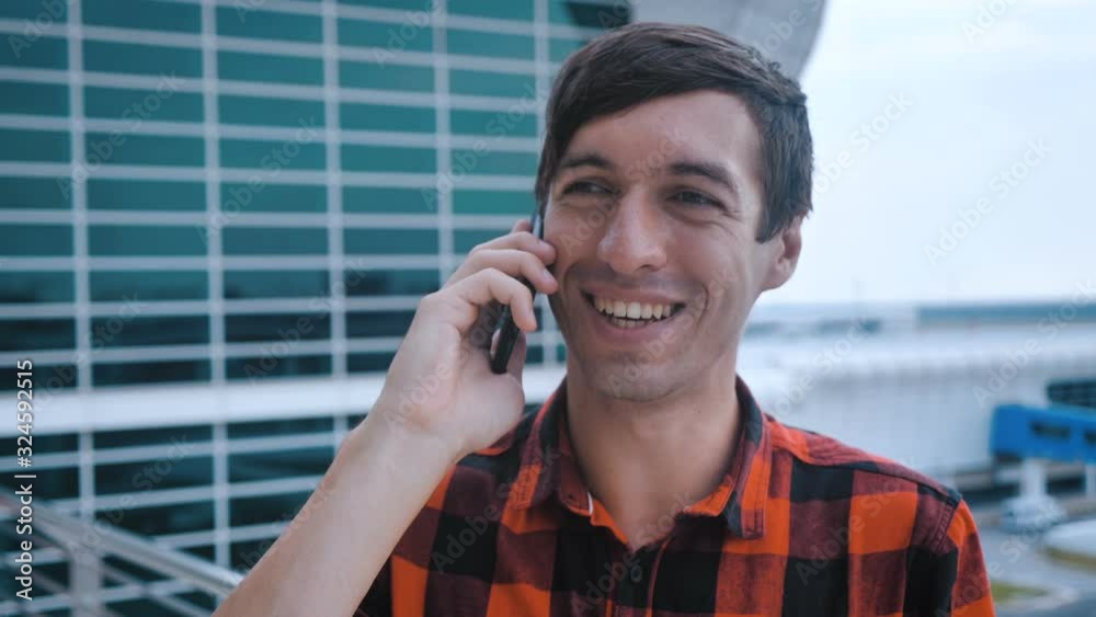 Young Attractive Man Standing near Big Modern Office Building. Talking ...