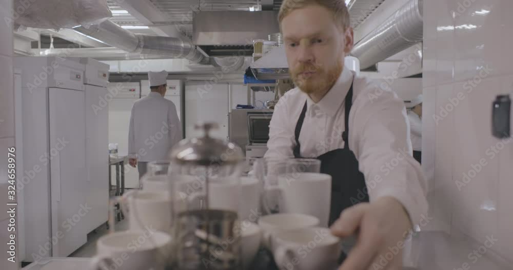 Waiter taking tray with dirty dishes in restaurant kitchen Stock ビデオ ...
