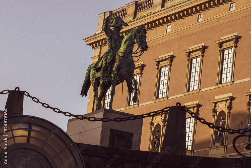 A statue in the form of a rider on a horse, in the center of the square ...