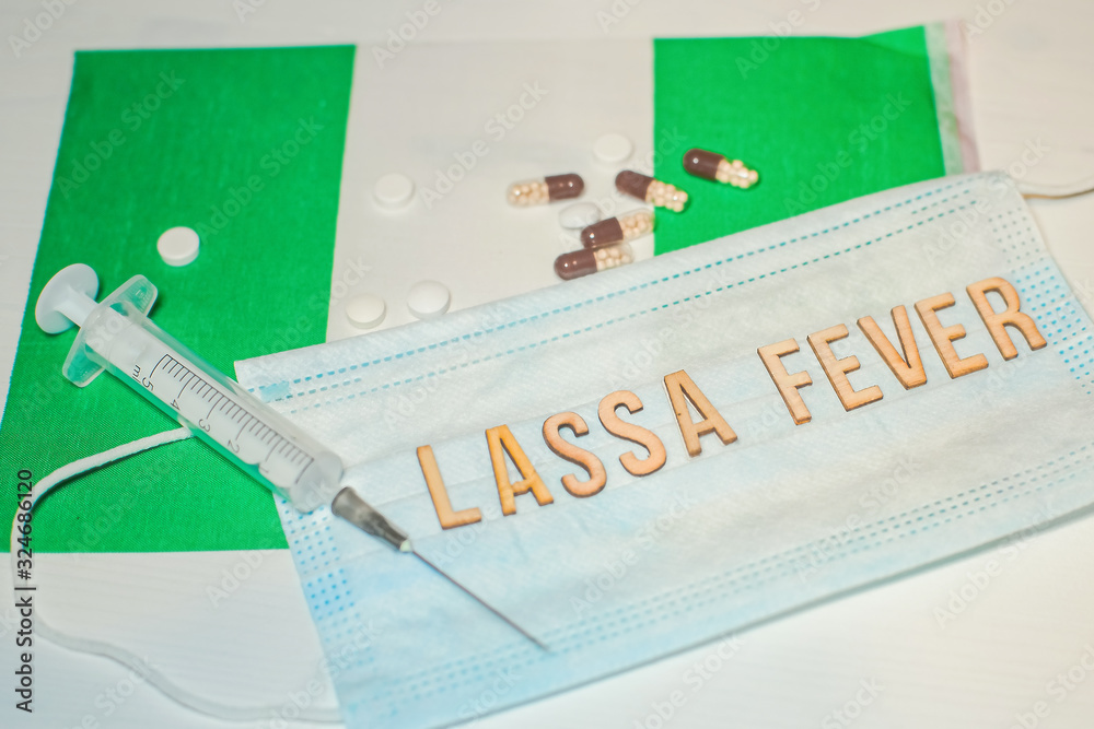 Nigerian Flag Under Words Lassa Fever Outbreak Concept Protective Breathing Mask And Syringe