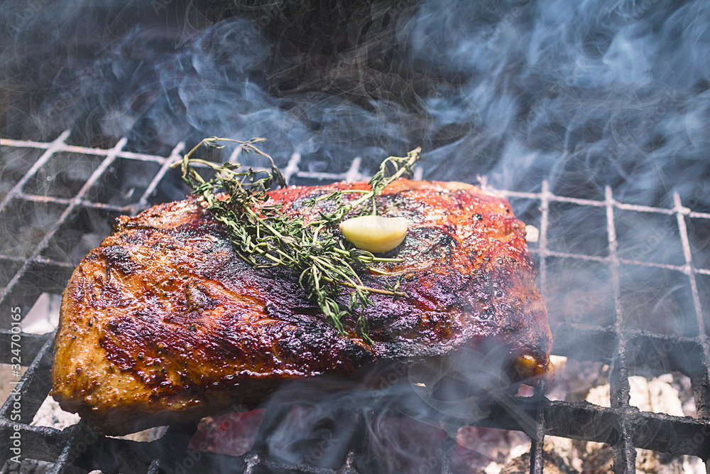 Delicious juicy grilled pork ribs, steak cooked meat on grill. Barbecue ...