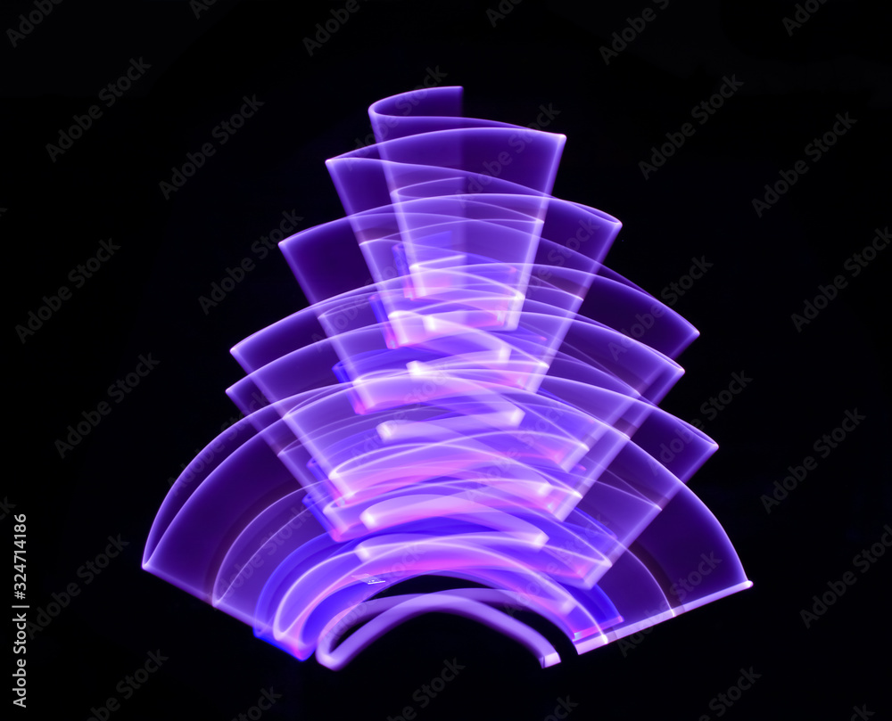 Curved abstract shape made with a light saber violet. Lightpainting ...