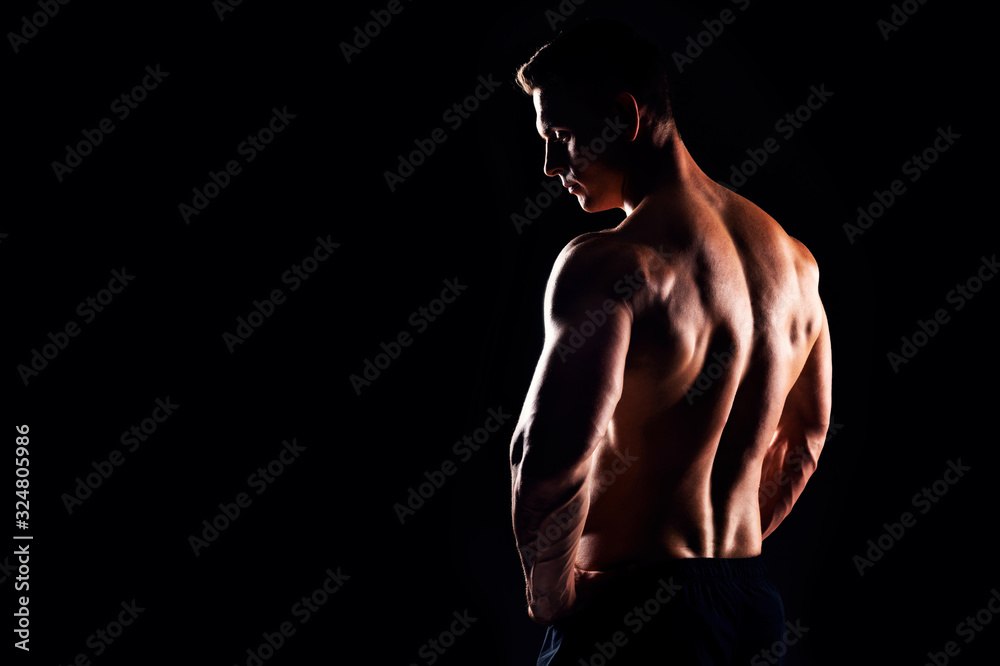 Strong, fit and sporty bodybuilder man over black background. Stock ...