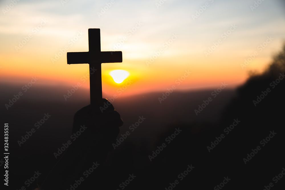 Religious concepts. Christian wooden cross on a background with ...