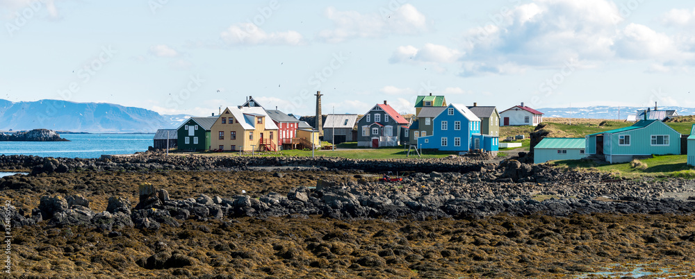 Panorama of Colorful buildings and the charming city of Flatey Island ...