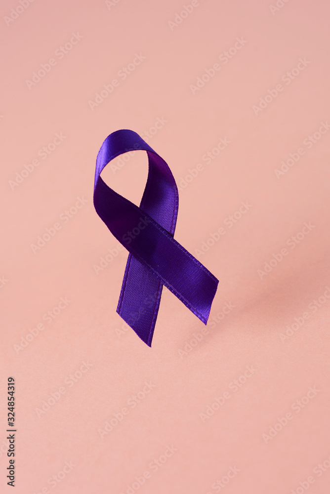 purple ribbon on a pink background. Stock Photo | Adobe Stock