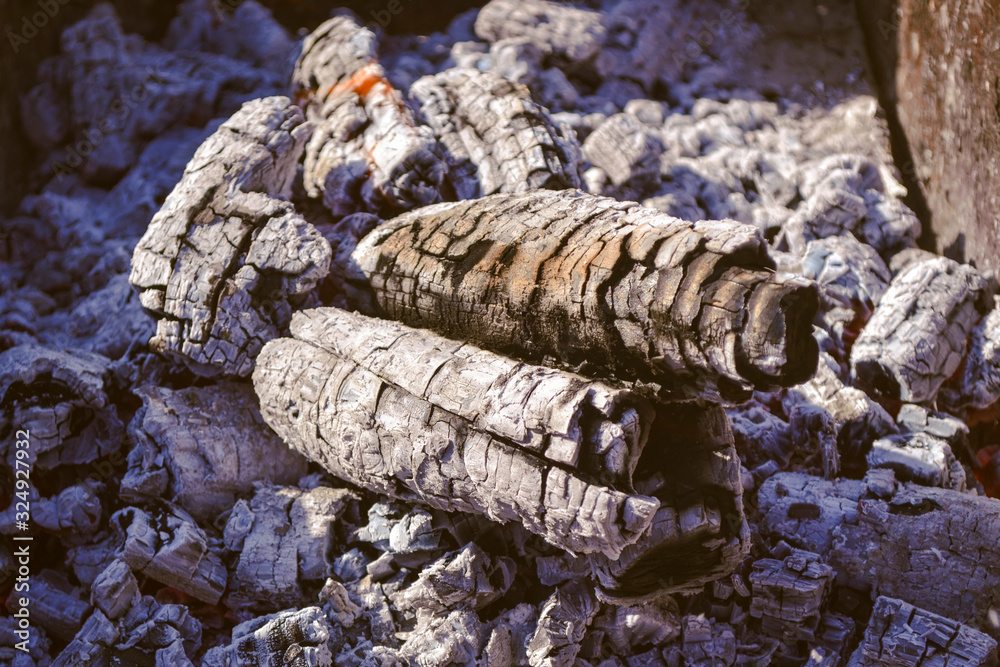 Smoldering ashes of a bonfire. Incandescent orange and red embers ...