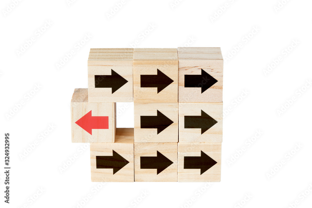 Wooden blocks with several black arrows and one block with red arrow ...