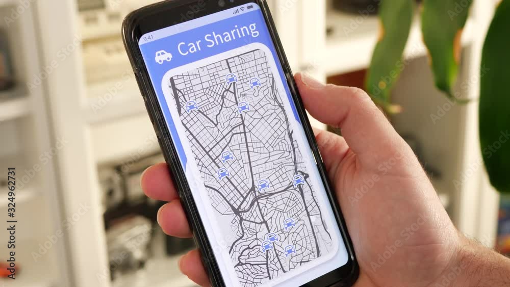 Vidéo Stock Looking at the interactive map of a ride-sharing app ...